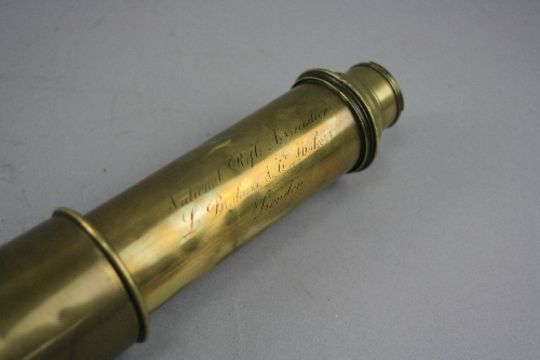 A LARGE HAND HELD PERISCOPE, approximately 95cm in length, of brass and ...