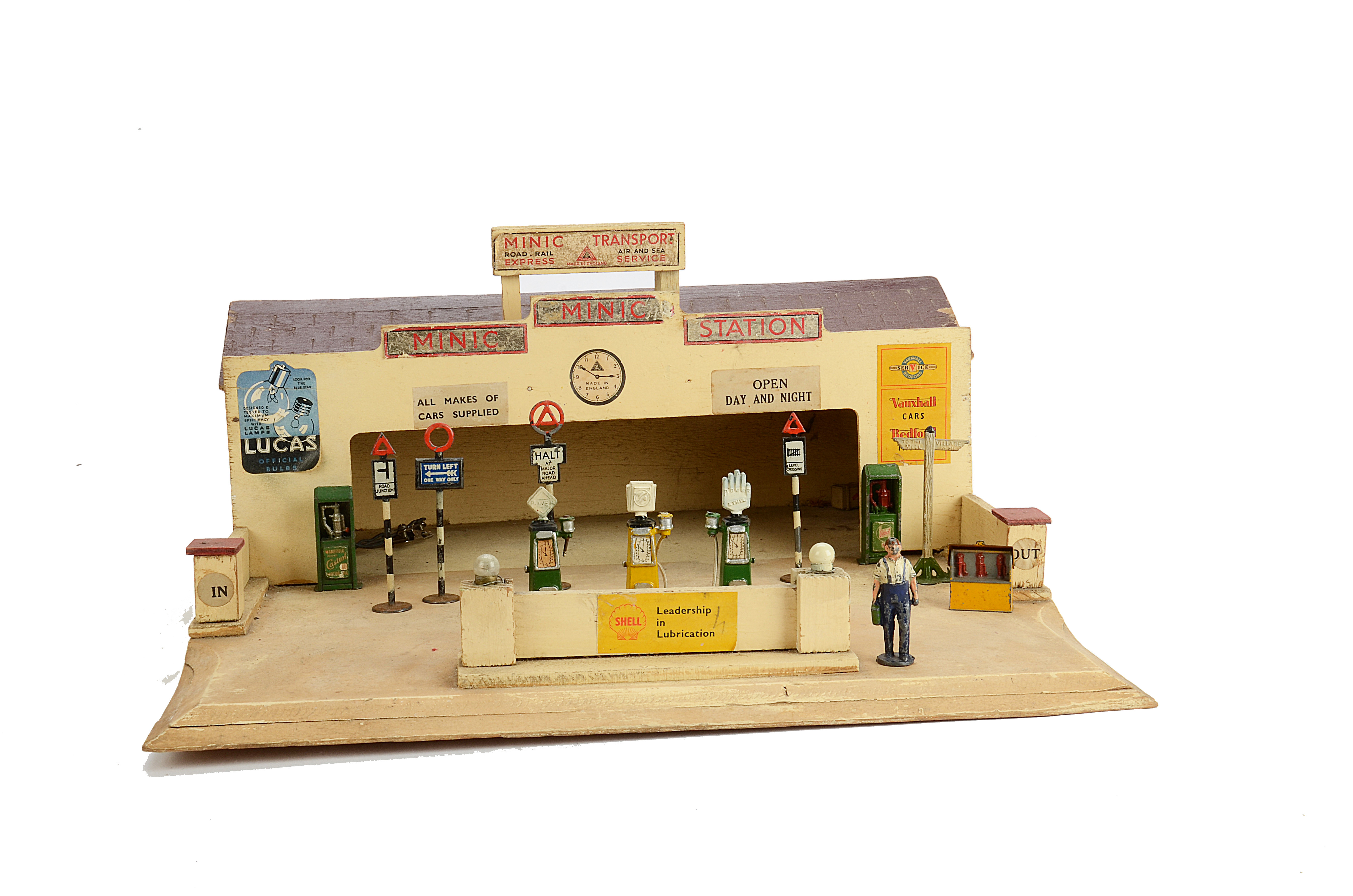A Tri-ang Minic wooden Garage, with in and out drive, various die-cast ...