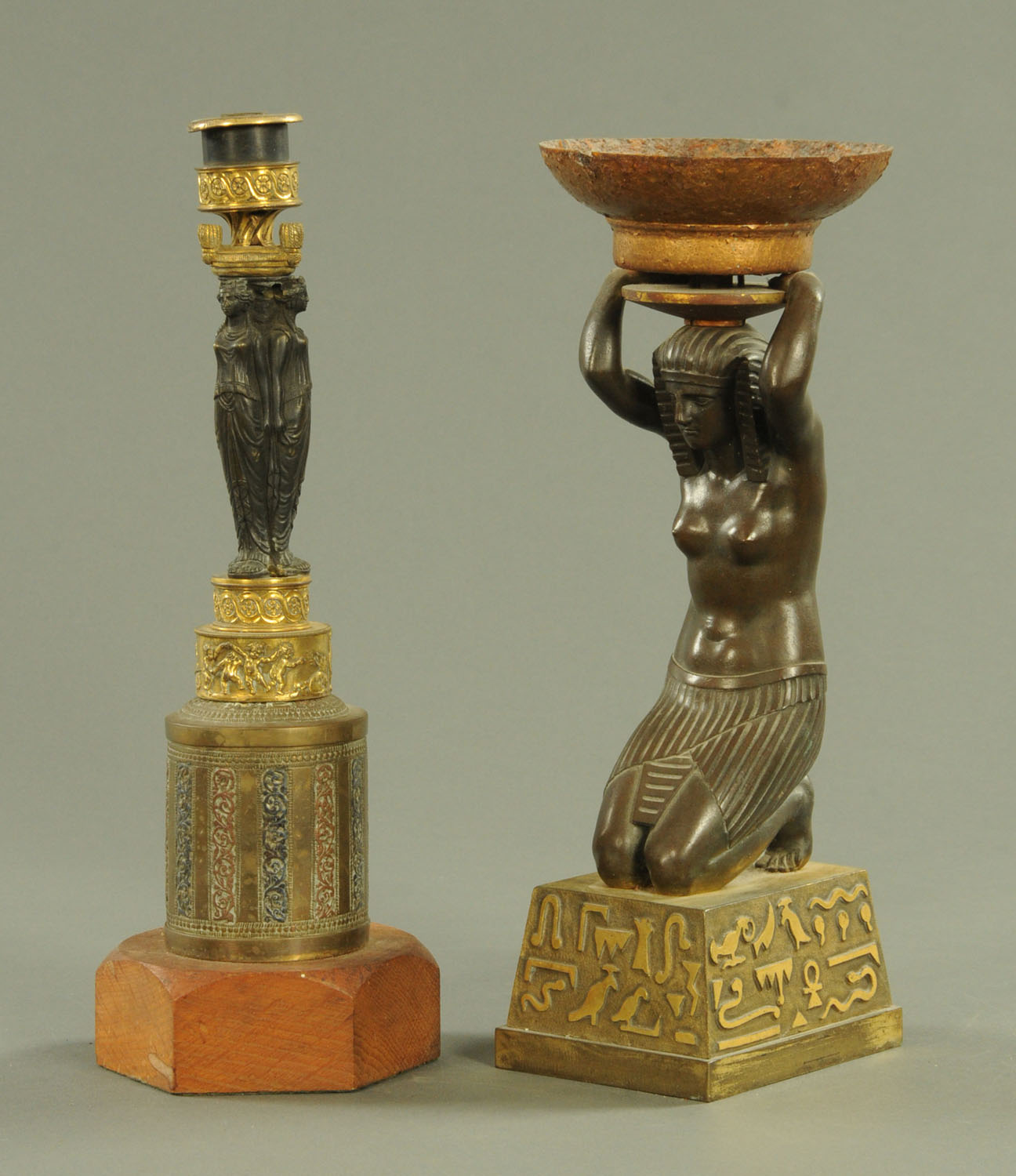A bronze table lamp base in the form of a kneeling Egyptian figure ...