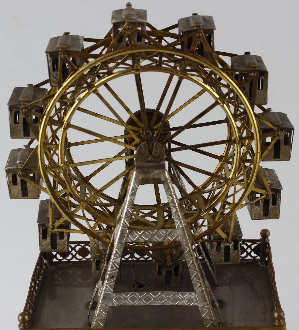 An early 20th century carriage clock with ferris wheel automaton ...