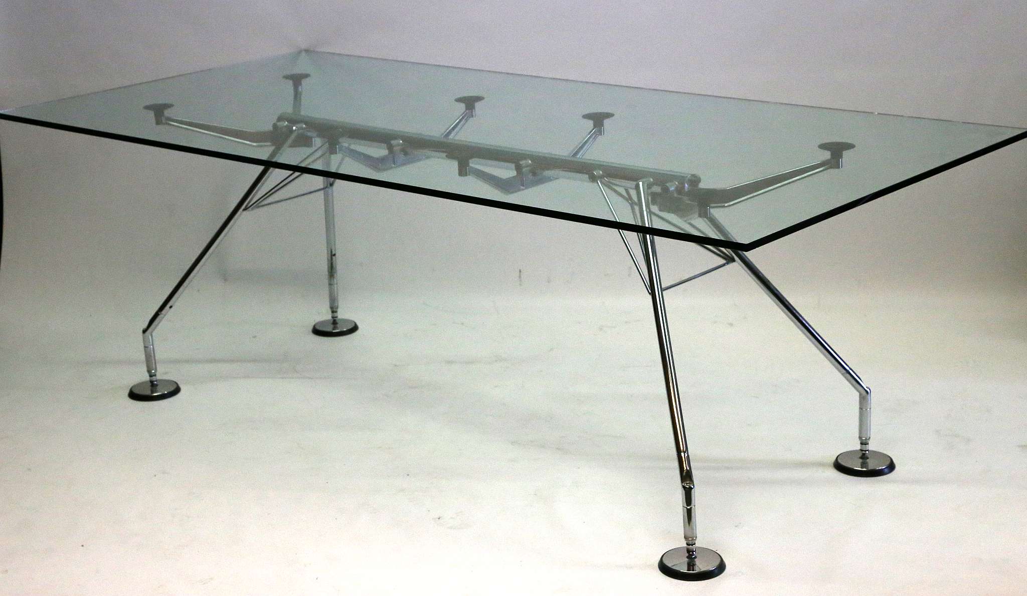 A NOMOS TABLE by NORMAN FOSTER for TECNO, glass top on chrome base ...