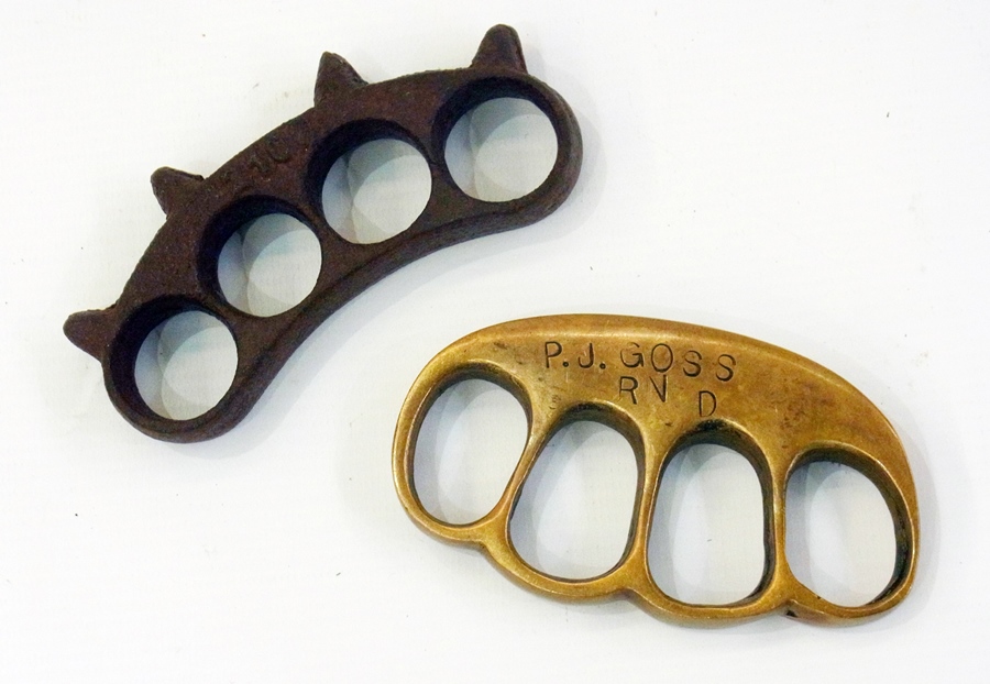 Two WW1 British knuckle dusters, one stamped "P. J. Goss RND 1915"