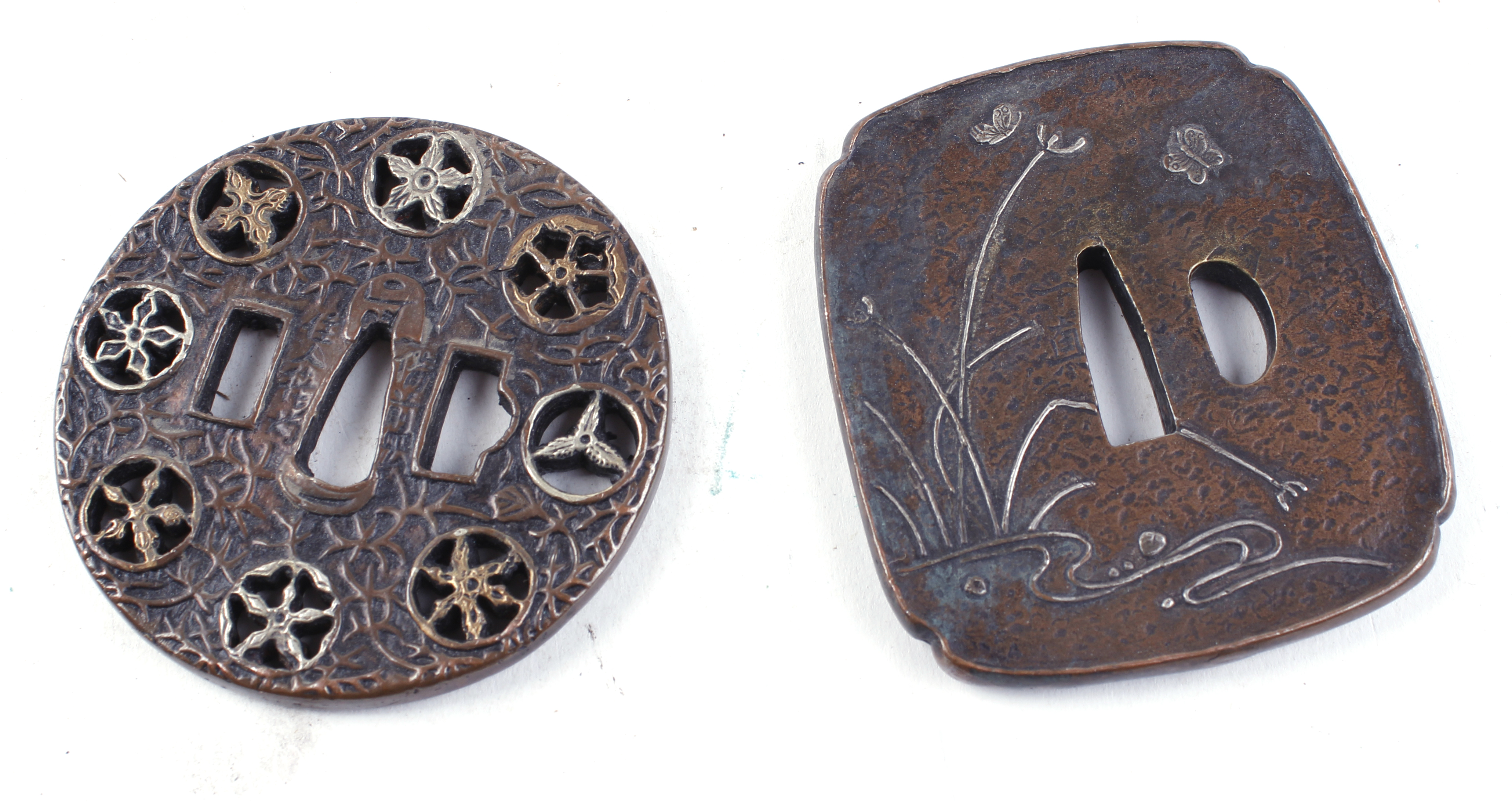 Two Japanese Tsuba: signed circular bronze tsuba decorated with ...