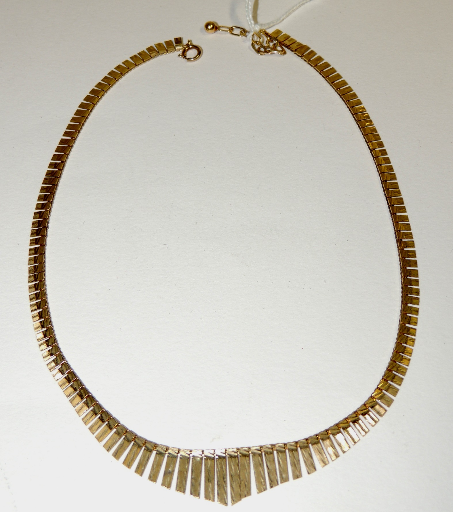 A 9ct gold necklace (tested) of Cleopatra form. 16g approx.