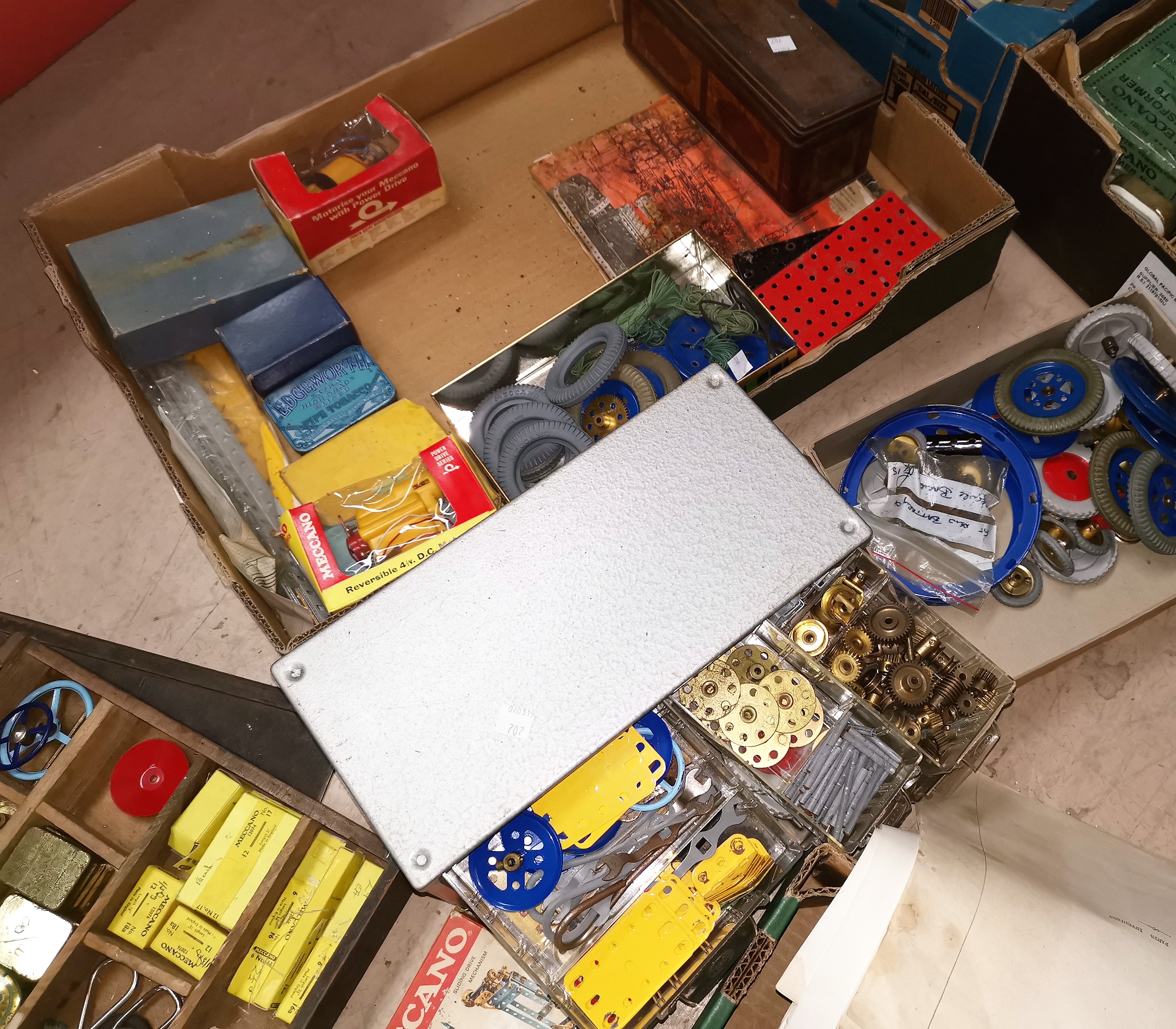 A large collection of Meccano parts, including originally packeted ...