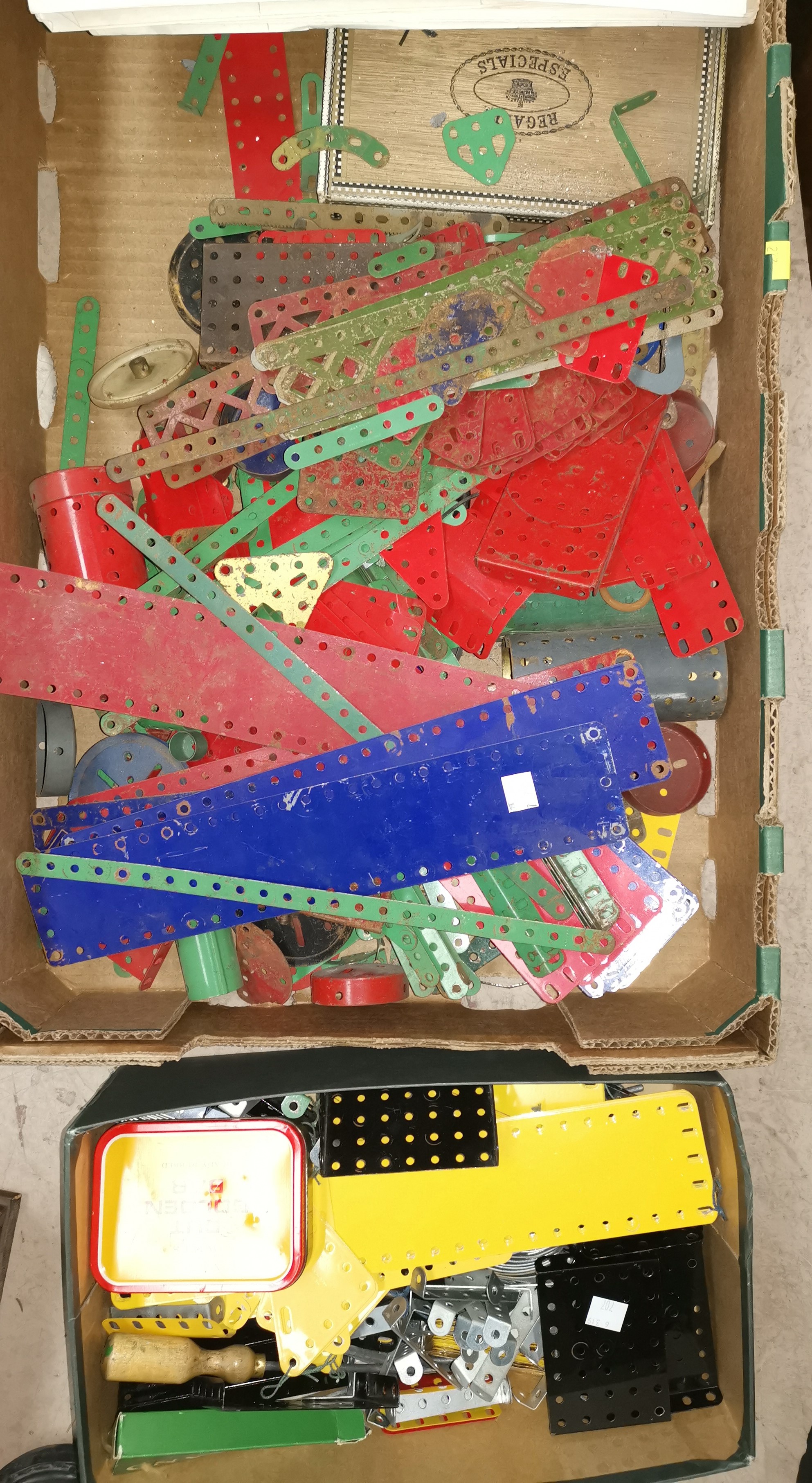 A large collection of Meccano parts, including originally packeted ...