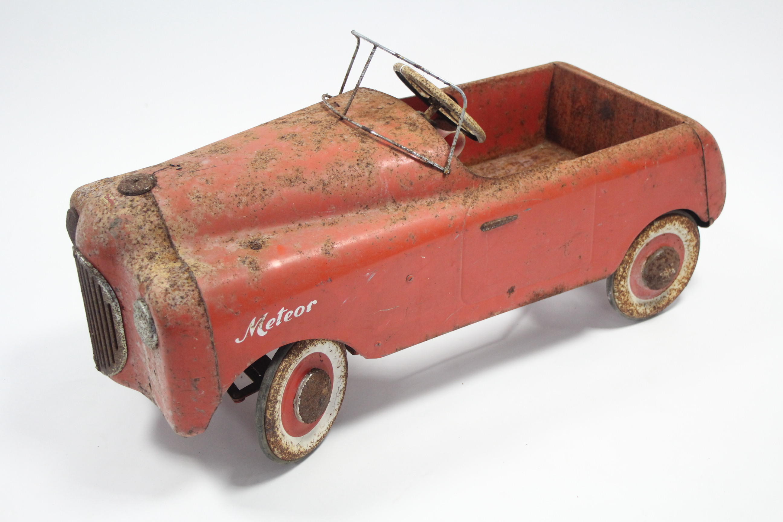A 1950’s Tri-ang “Meteor” pedal car (red), 41” long, w.a.f.