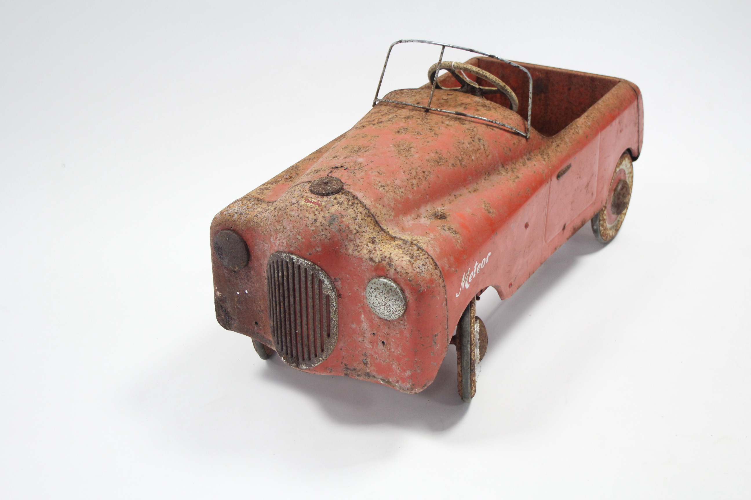 A 1950’s Tri-ang “Meteor” pedal car (red), 41” long, w.a.f.