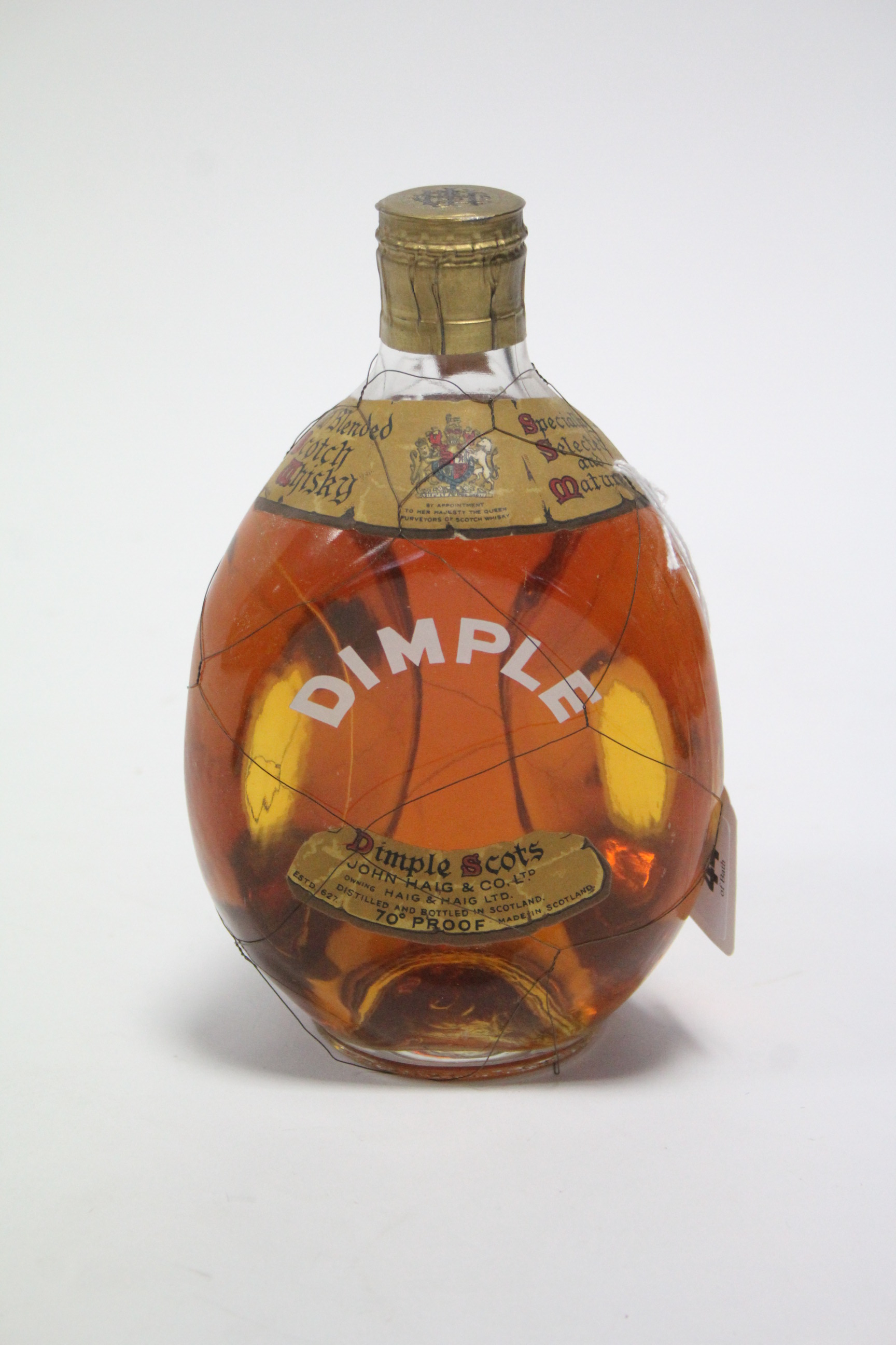 A bottle of Haig’s “Dimple” Old Blended Scotch Whisky; & approximately ...