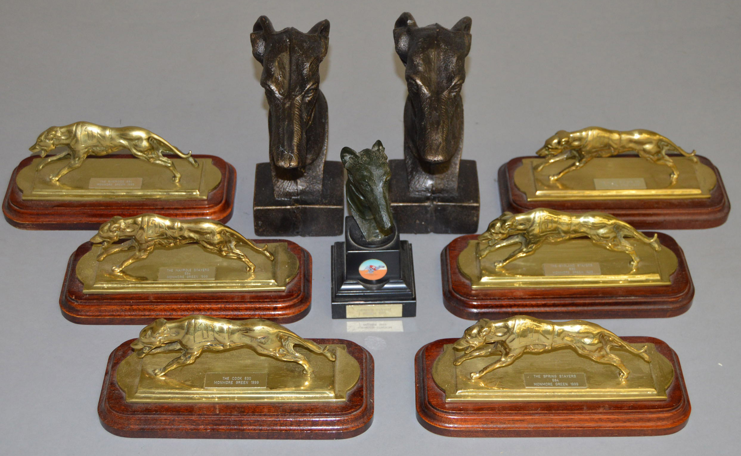 A quantity of various Greyhound racing trophies including brass mounted ...