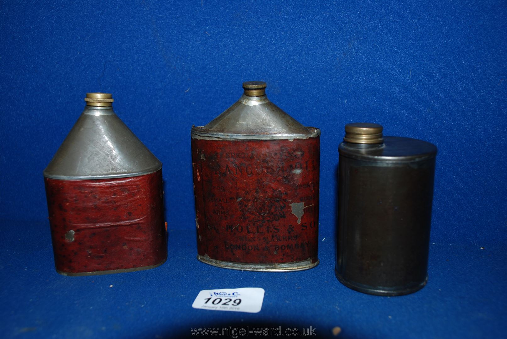 Two Rangoon Oil Bottles and one other.
