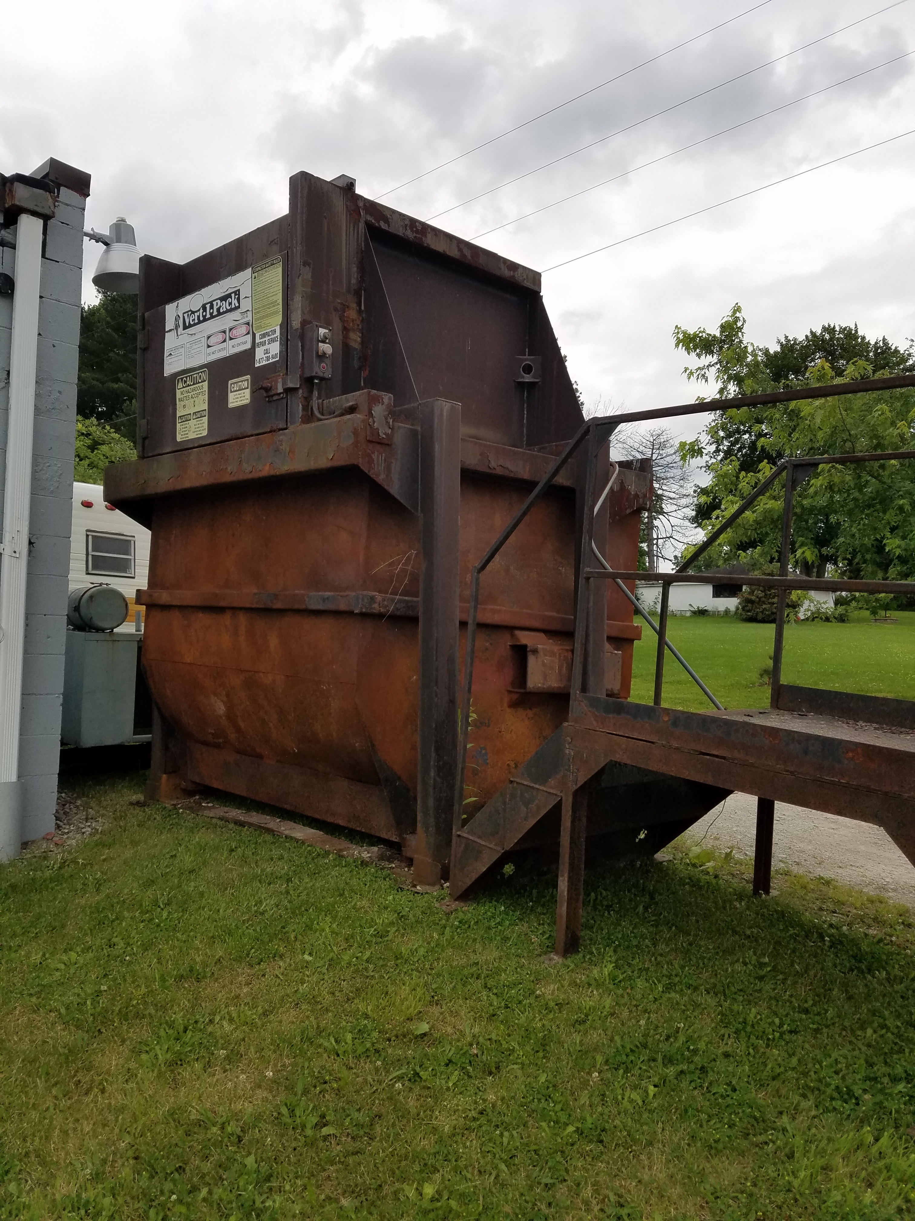 VERT-I-PACK COMPACTOR W/ DUMPSTER & STAIRS