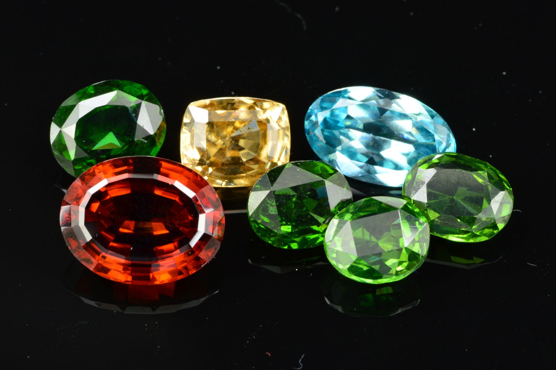 A COLLECTION OF ZIRCON GEMSTONES, to include various cuts and sizes ...
