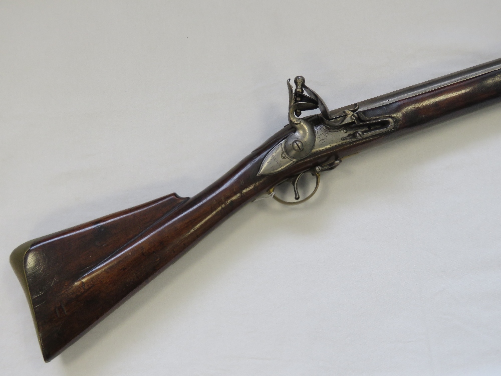 An original early 18th century flintlock rifle, London made and bearing ...