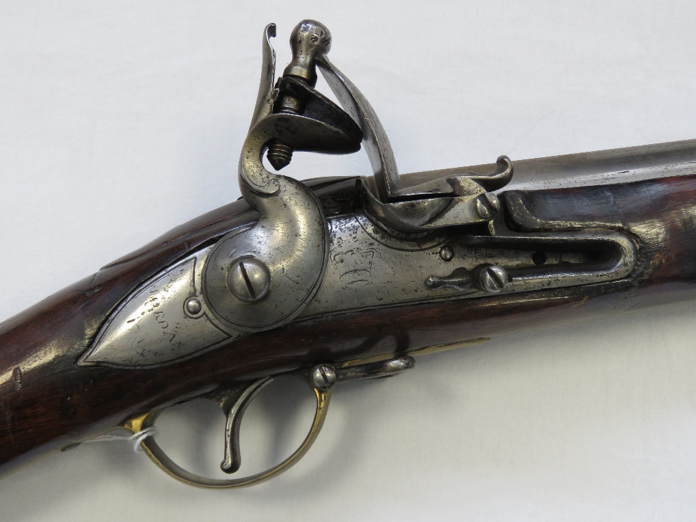 An original early 18th century flintlock rifle, London made and bearing ...
