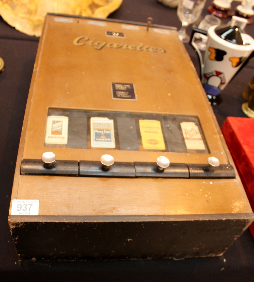 Vintage wooden cigarette vending machine