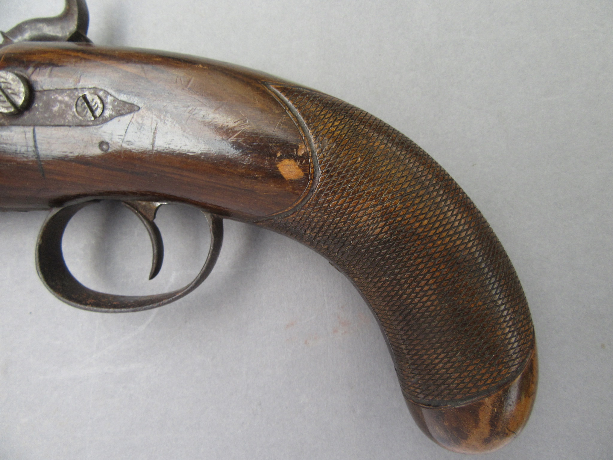 An early 19th century percussion cap pistol with octagonal barrel ...