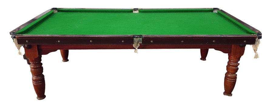 Half size snooker table, with green baize the frame supported by turned ...