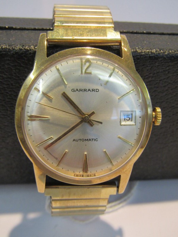 9CT GOLD GENTLEMEN'S GARRARD AUTOMATIC WRIST WATCH, with inscription ...