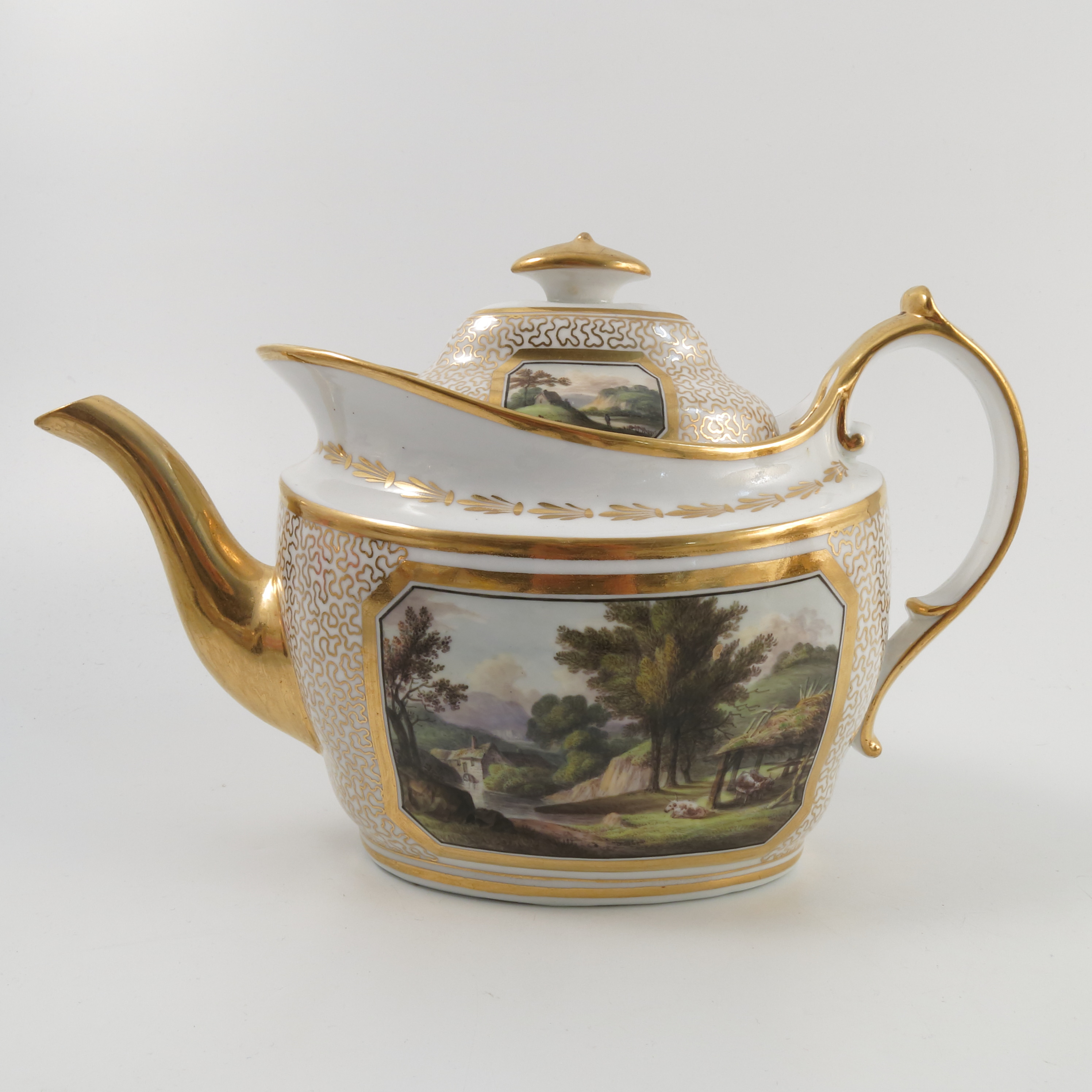A 19th century English porcelain tea pot, decorated with rectangular ...