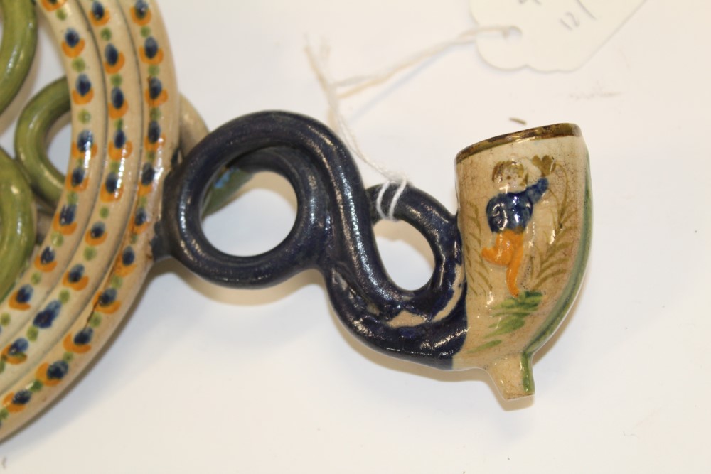 Three early 19th century Prattware coiled pipes - the largest 34cm long ...