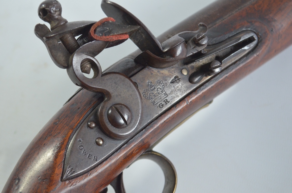 A flintlock pistol, the barrel stamped with various proof marks, the ...