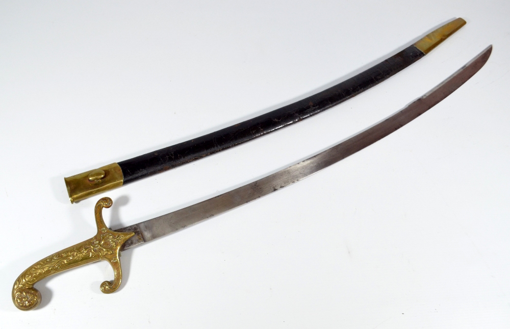 A WWI period sabre, with foliate embossed brass handle, curved blade ...