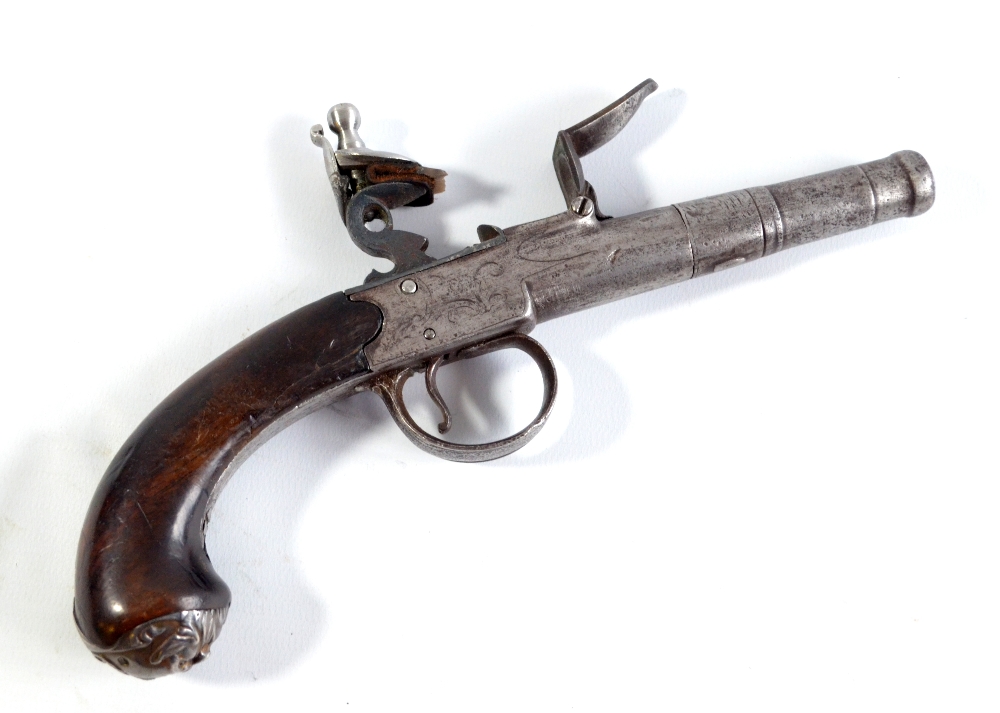 A small flintlock pistol with screw-off cannon barrel, indistinctly ...