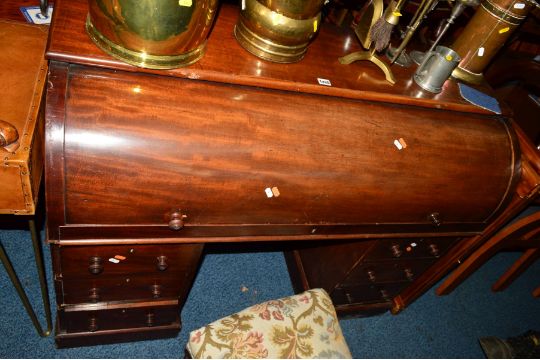 A VICTORIAN MAHOGANY BARREL TOP DESK with six various drawers, width ...