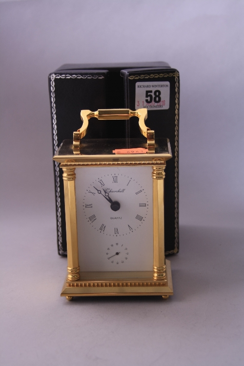 A CHURCHILL CARRIAGE CLOCK, with box, battery operated
