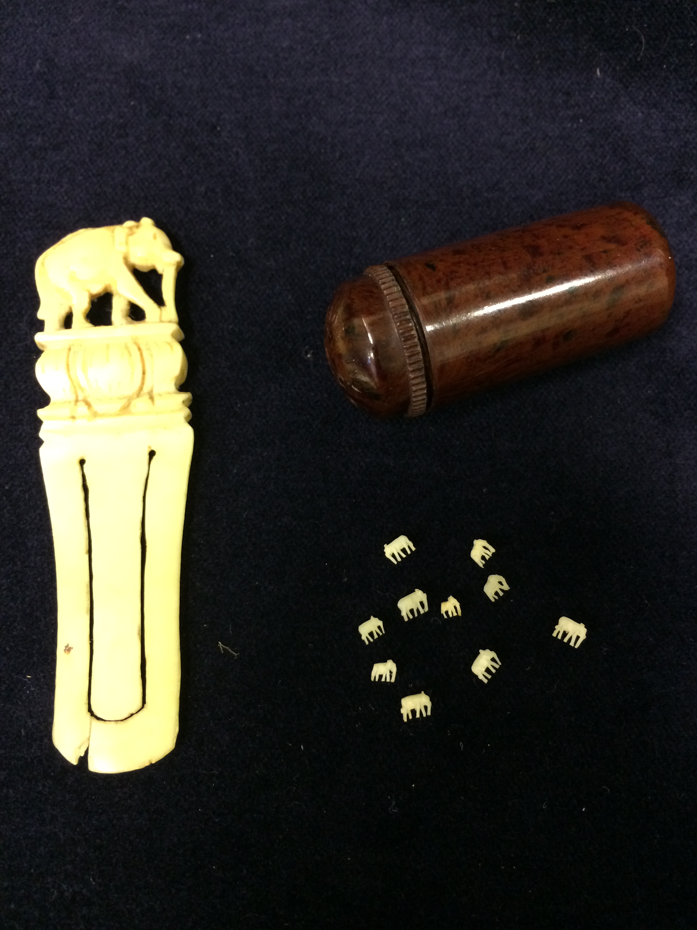 An antique ivory bookmark and a number of miniature carved ivory ...