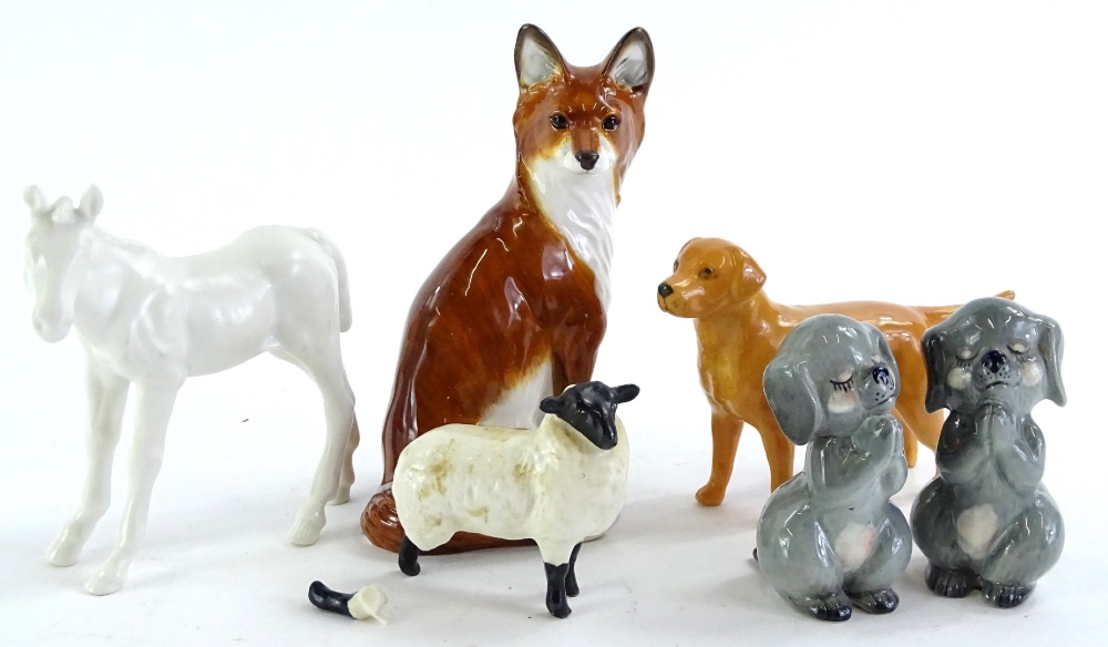 A collection of Beswick animals, to include a seated John Beswick fox ...