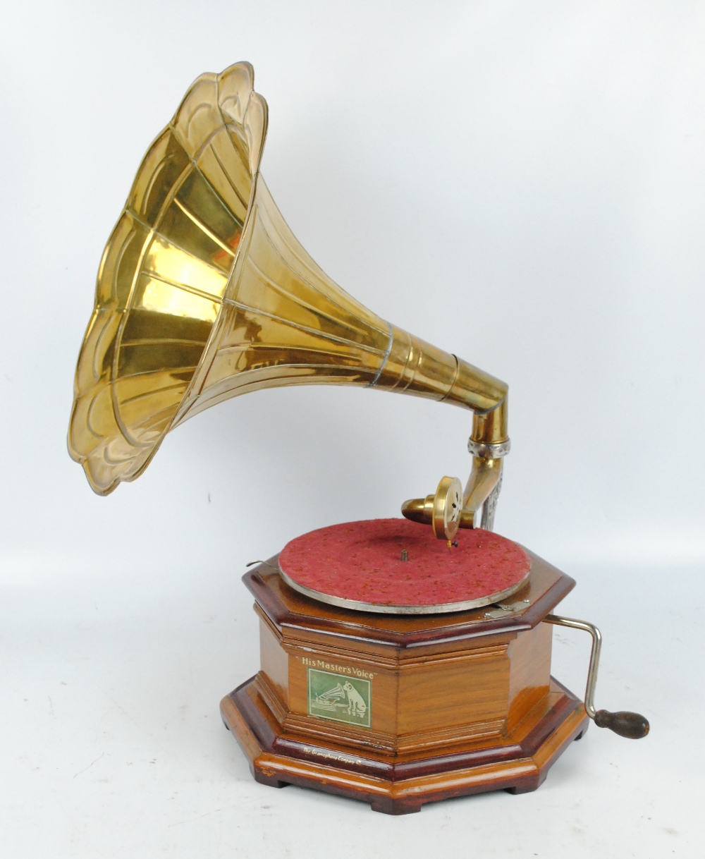 A reproduction HMV gramophone with brass horn.