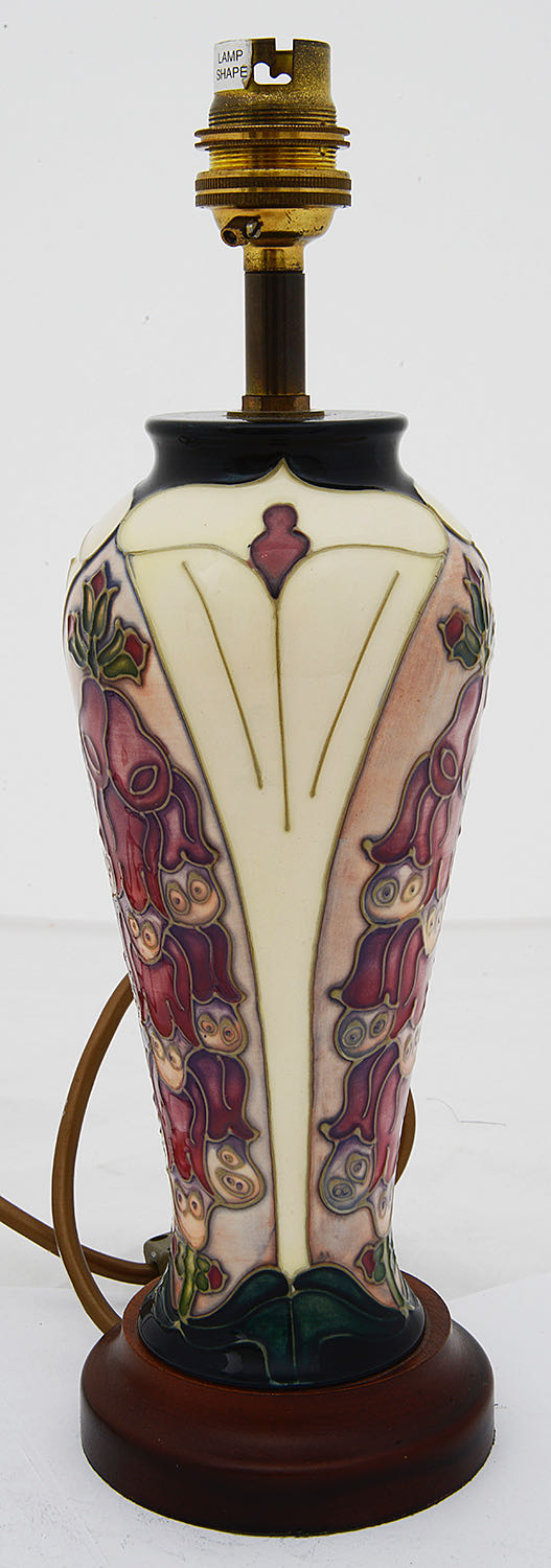 A modern Moorcroft pottery 'Foxglove' pattern table lamp designed by ...