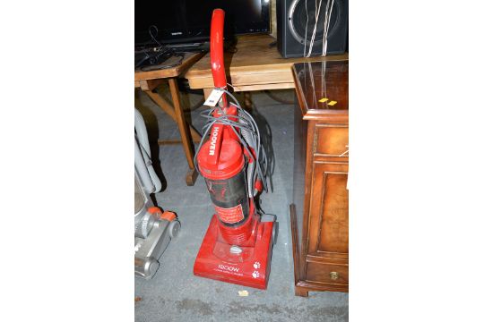 A modern Hoover 1900 watt vacuum cleaner with onboard attachments.