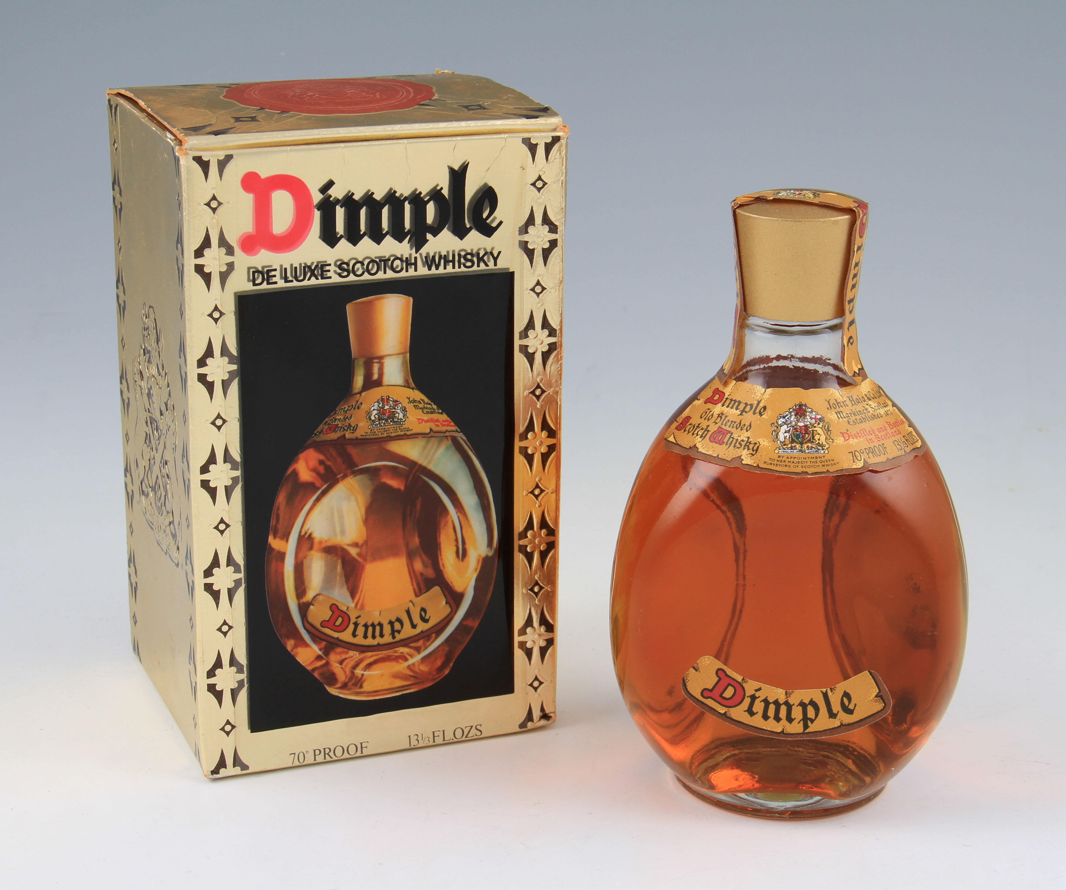 Dimple De Luxe Scotch Whisky. Old bottling 1960's. 70 proof, 13 1/3 fl ozs.