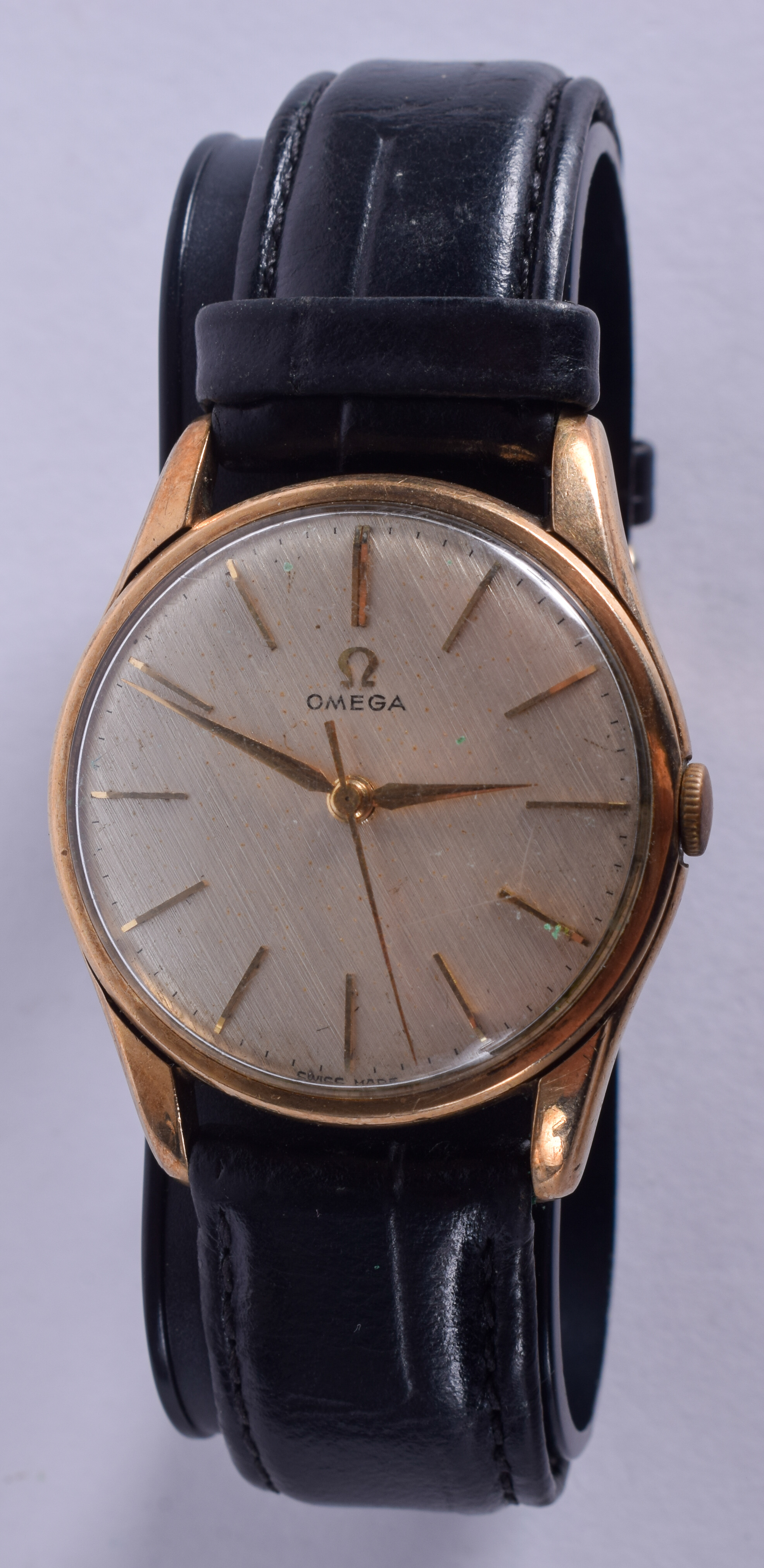 A VINTAGE 9CT GOLD OMEGA WRISTWATCH with original strap. 3.5 cm diameter.