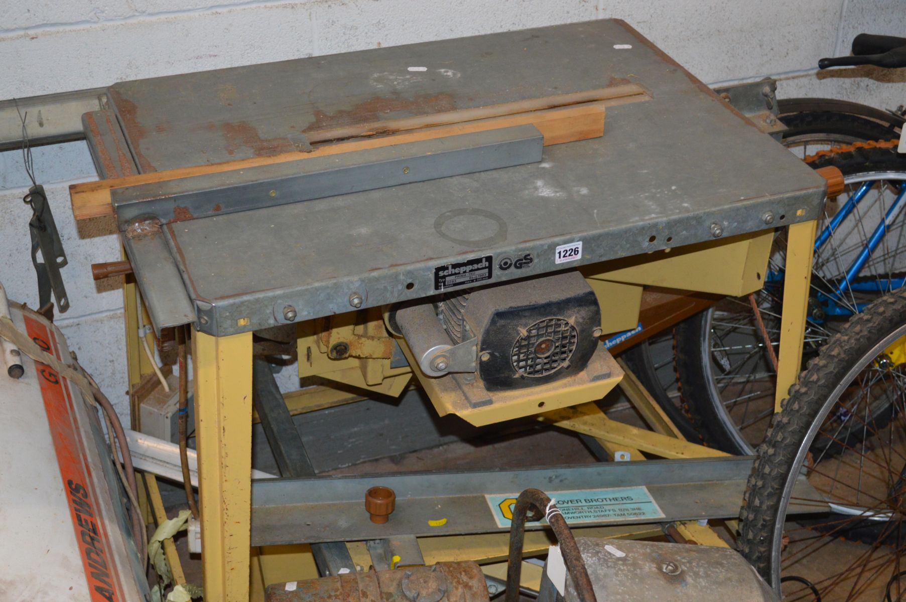AN ELECTRIC STEEL FRAMED JIGSAW BENCH and saw