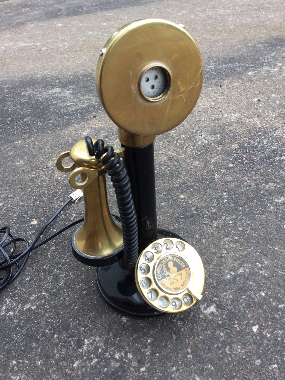A replica Edwardian wall-mounting telephone with brass mounts and twin ...