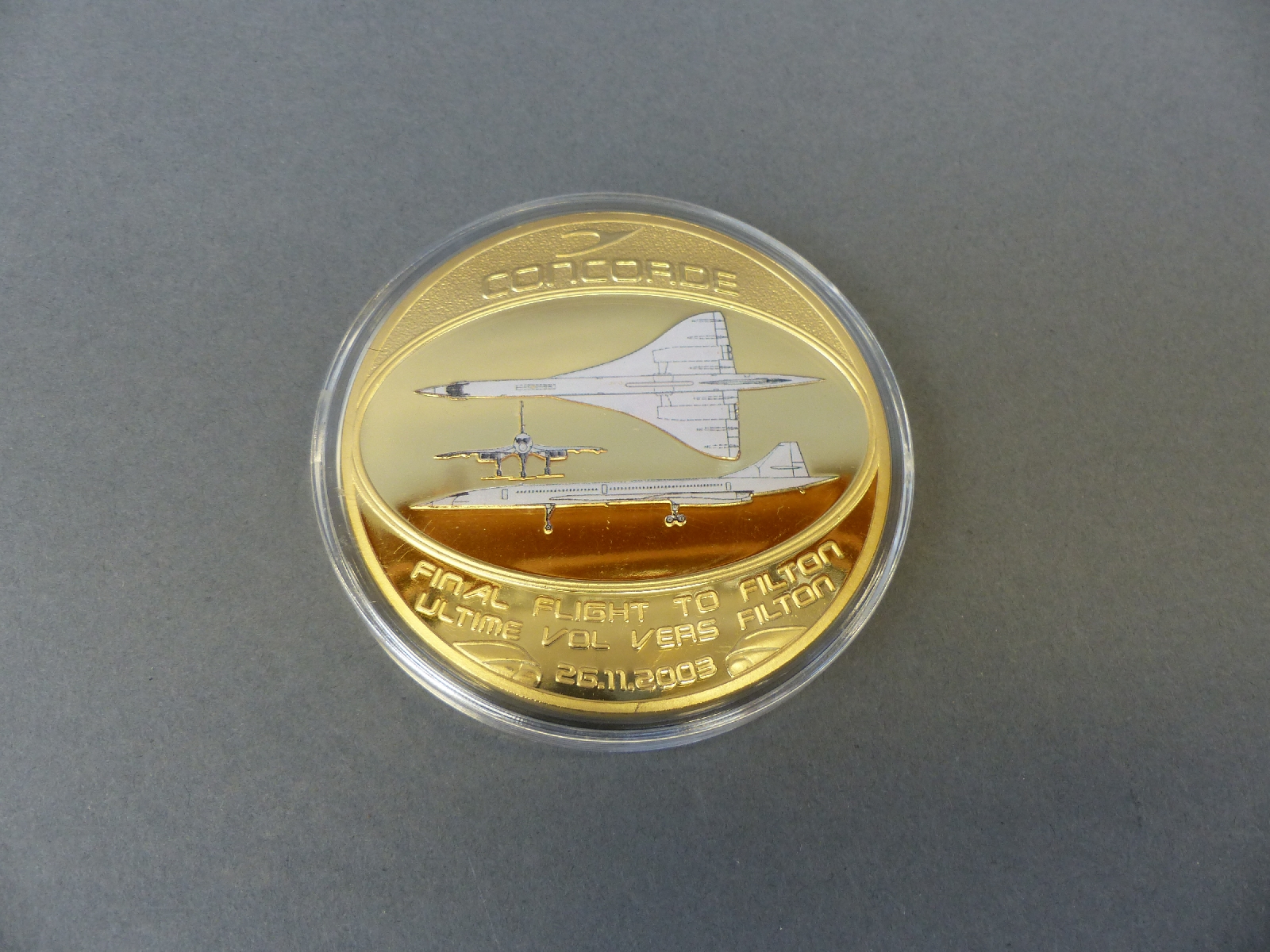 A miniature gold proof commemorative coin for Concorde's final farewell ...