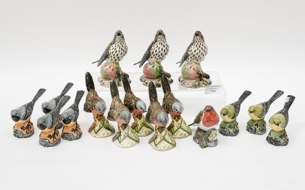 A collection of 16 Mack fine bone china bird figures, all hand painted ...