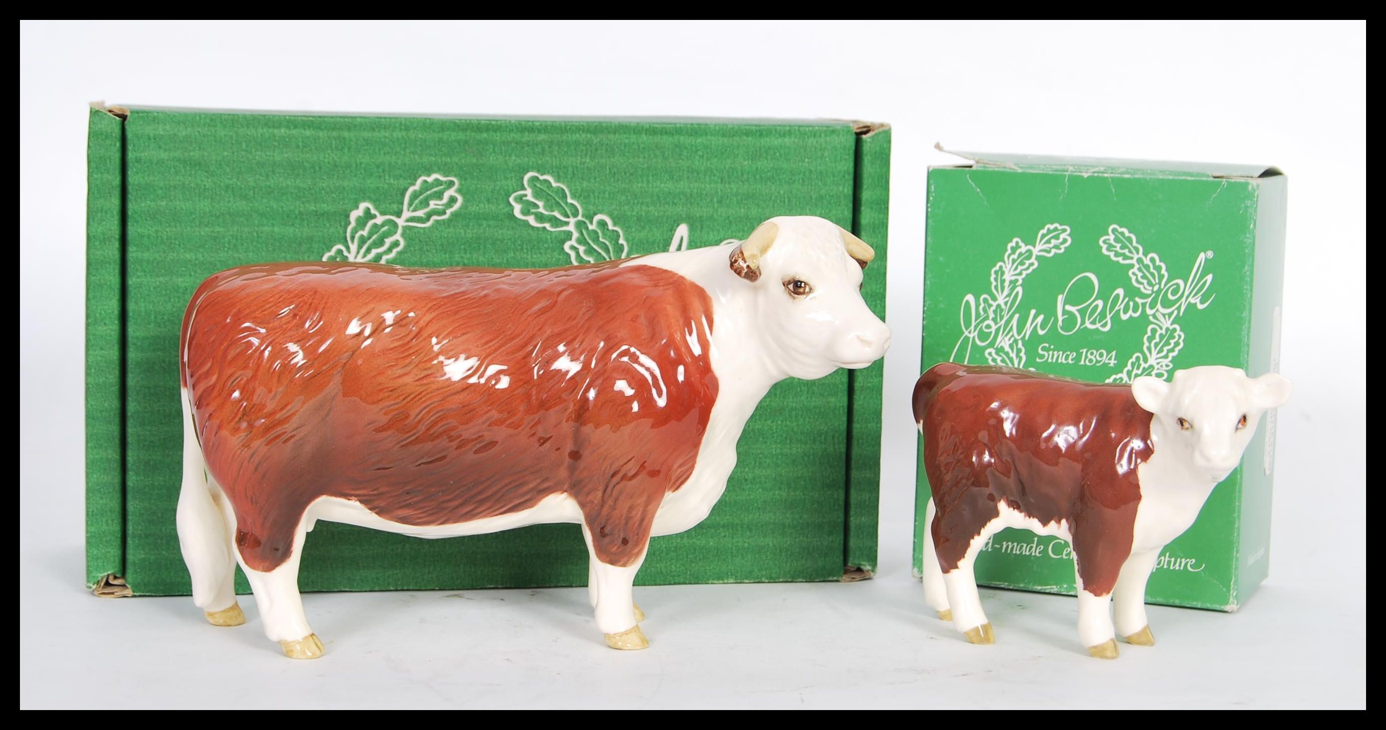 Two Beswick ceramic figurines of Hereford cows to include a Bull Cow ...