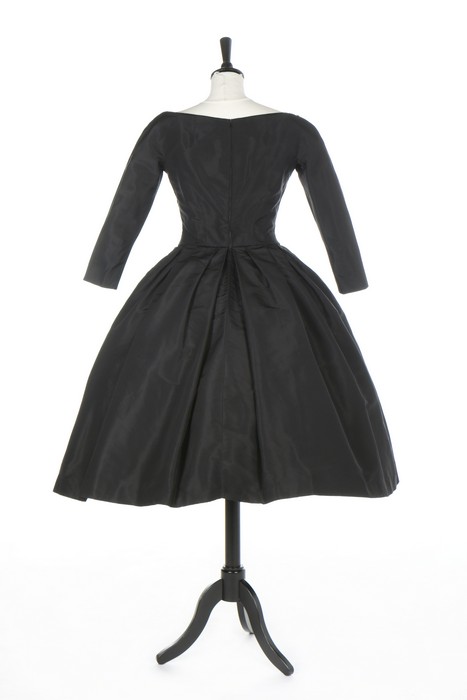 A Christian Dior couture black faille cocktail dress, 'Fuseau' (Spindle ...