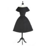 A Christian Dior couture black faille cocktail dress, 'Fuseau' (Spindle ...