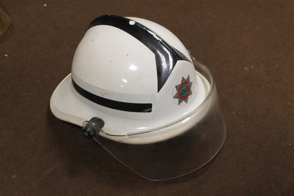 A COLLECTION OF ELEVEN USED 1990S PACIFIC FIRE HELMETS (Staffordshire ...