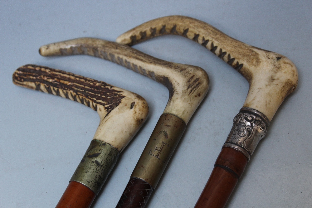 A HALLMARKED SILVER MOUNTED RIDING CROP - BIRMINGHAM 1897, together ...
