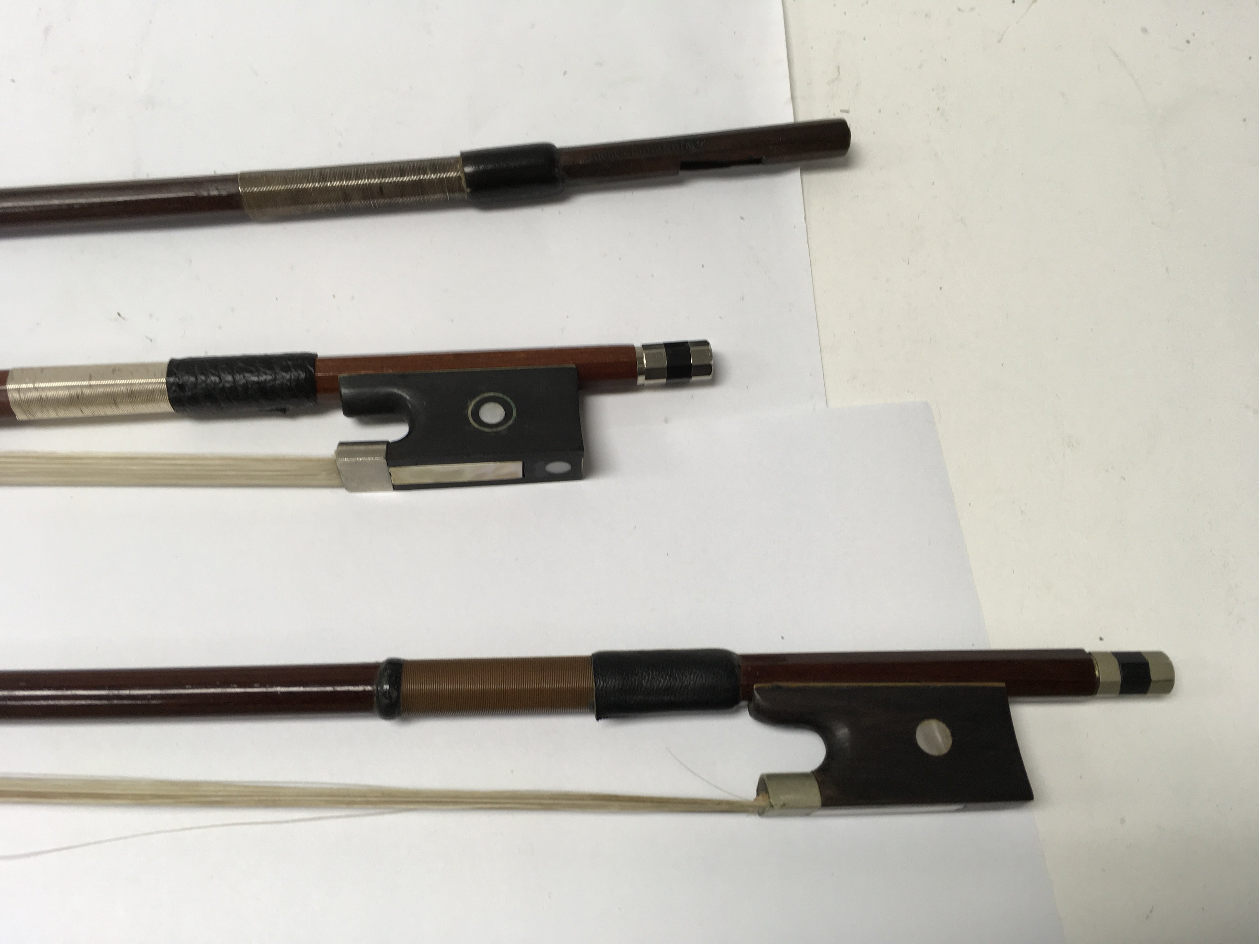 A group of three violin bow sticks to include one by Arthur Joseph ...