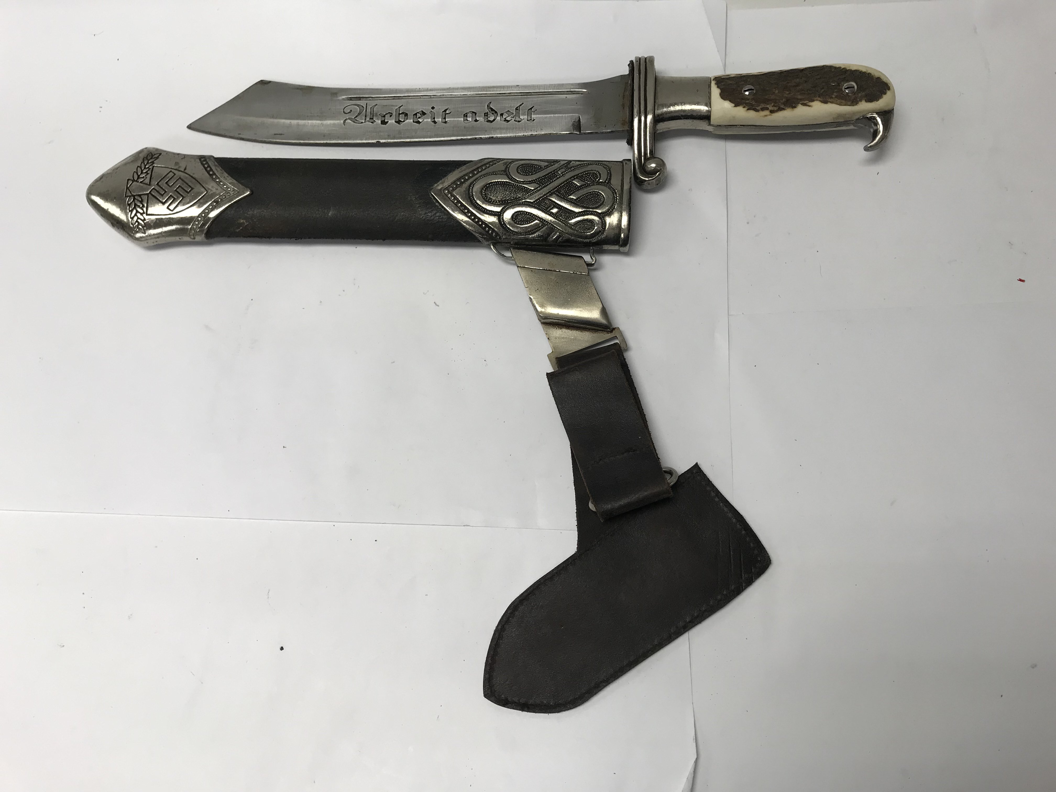 A replica German WW2 RAD Hewer dagger with scabbard, leather hanger and ...