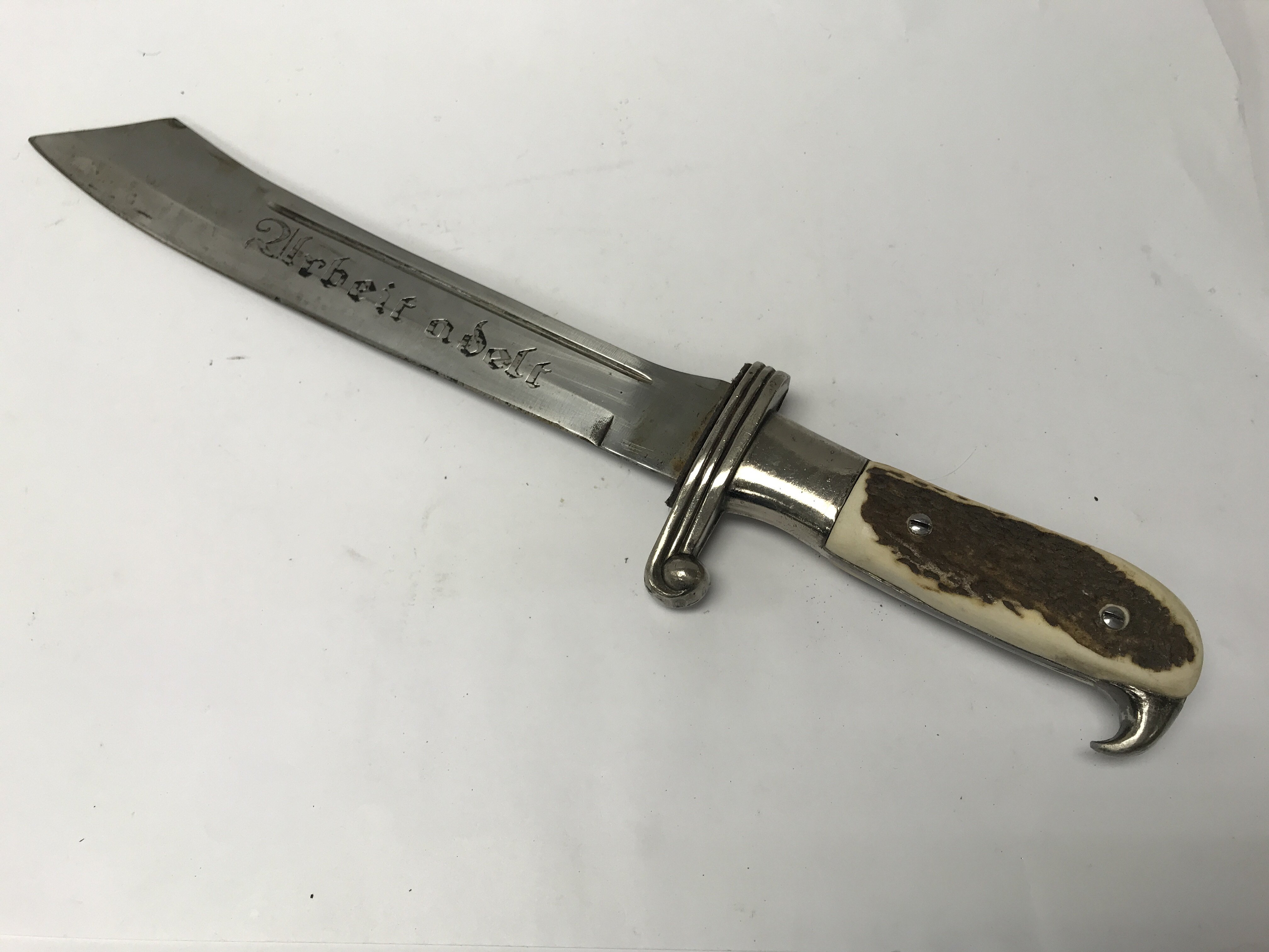 A replica German WW2 RAD Hewer dagger with scabbard, leather hanger and ...