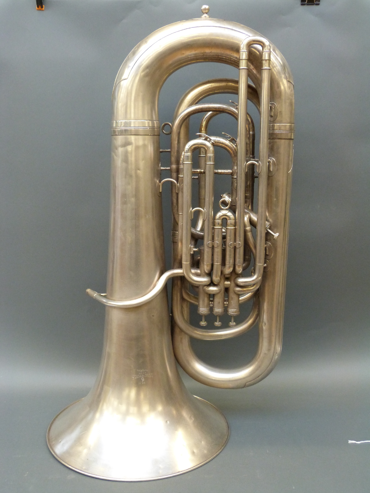 A cased E Flat tuba by Boosey & Hawkes in silvered finish, 104cm long ...